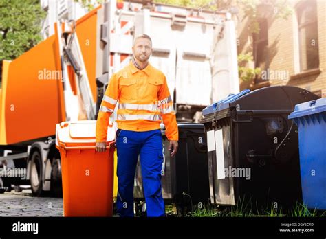 Garbage Removal Man Doing Trash And Rubbish Collection Stock Photo Alamy