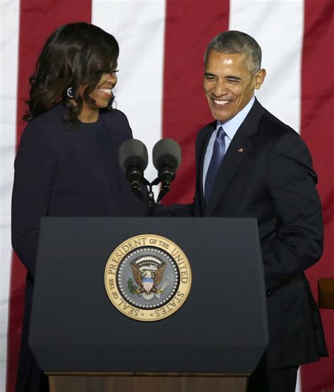 President Obama Embraces First Lady Michelle Obama At Campaign Rally In