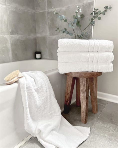 Small Wooden Bathroom Stool With White Towels Soul And Lane