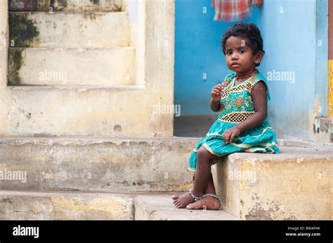 Young Indian Village Girl Sat Outside A House In Puttaparthi Andhra