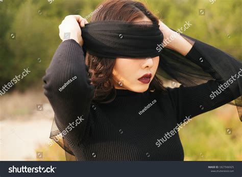 100641 Black Woman Removing Blindfold Royalty Free Images Stock