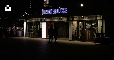 People Walking On Sidewalk During Night Time Photo Free Hamburg Image
