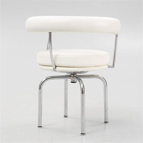 A Lc 7 Swivel Chair By Charlotte Perriand And Pierre Jeanneret And Le