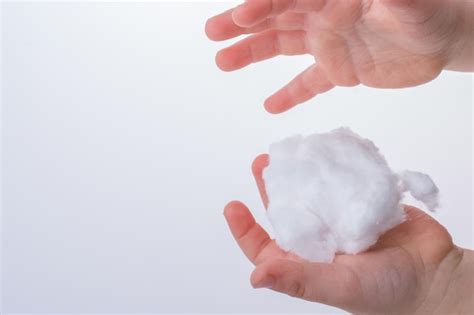 Premium Photo Hand Holding Some Cotton In Hand