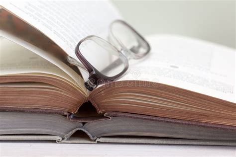 Glasses And Open Books On The Table Stock Image Image Of Document