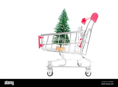 Artificial Toy Christmas Tree Placed In A Miniature Push Cart Isolated