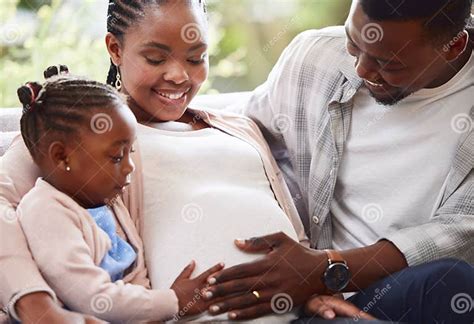 Everybody Wants A Piece An Attractive Young Pregnant Woman Sitting On