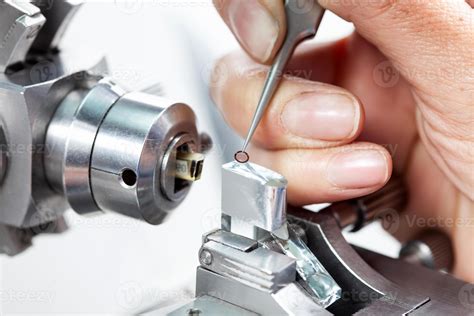 Closeup Of A Female Scientist Placing A Sample On A Transmission Electron Microscopy Grid