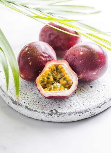 Premium Photo Ripe Passion Fruit Half And Slice Of Fruit On A White