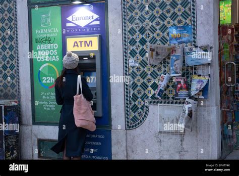 Girl Withdrawing Money At An ATM Stock Photo Alamy