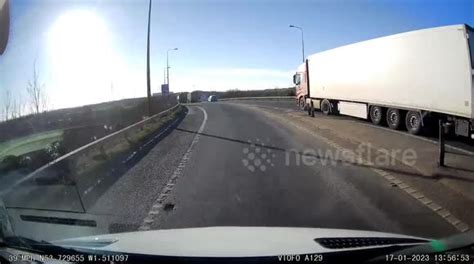 Impatient Angry Car Driver Undertakes Tipper Truck And Brake Checks