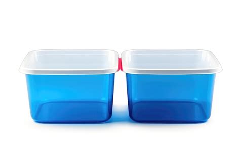 Premium Photo Two Blue Containers With Red Lids On White Background