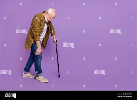 Full Body Photo Of Sad Granddad Grey Hair Touch Sick Leg Cane Wear