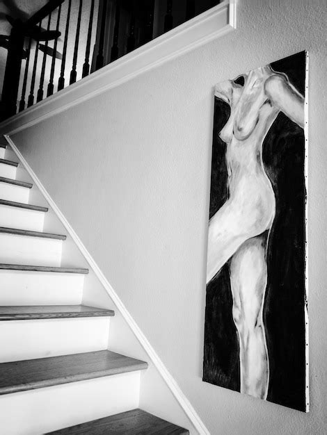 Premium Photo Naked Female Painting On Wall By Staircase At Home