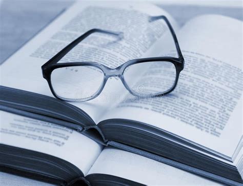 Glasses And Open Books On The Table In Soft Focus Sponsored Ad