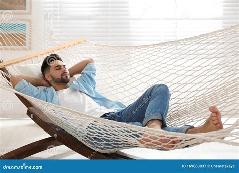 Young Man Relaxing In Hammock Stock Image Image Of Home Cozy 169663037