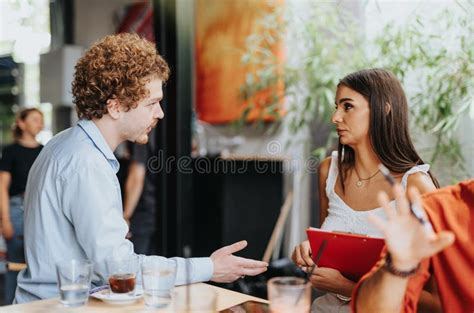 Corporate Team Discussing Sustainable Design For A New Architecture