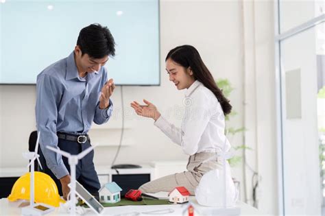 Collaboration And Engineering Two Engineers Discussing Sustainable