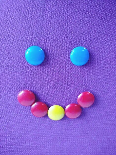 Premium Photo Close Up Of Anthropomorphic Smiley Face Made By Buttons