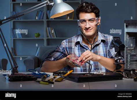 Computer Repair Concept With Man Inspecting With Stethoscope Stock Photo Alamy