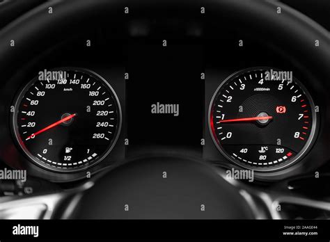 Close Up Of Round Dashboard Speedometer And Tachometer With White Backlight Modern Car