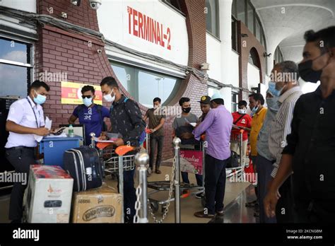 Migrant Workers Wait For Flights Outside Hazrat Shahjalal International