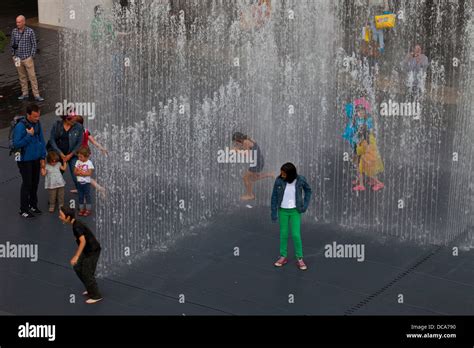 People Playing In The Appearing Rooms Interactive Water Fountains The