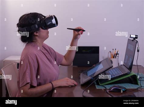 female virtual reality artist developer wearing vr headset create
