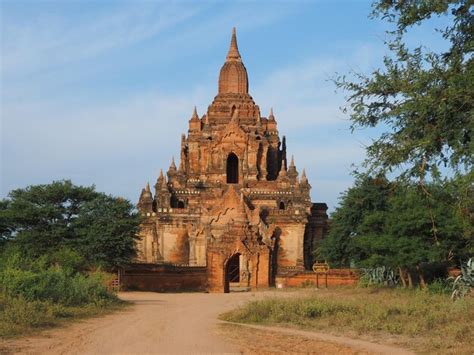 Premium Photo Old Temple On Field At Bagan