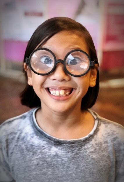 Premium Photo Portrait Of Cheerful Girl Wearing Eyeglasses