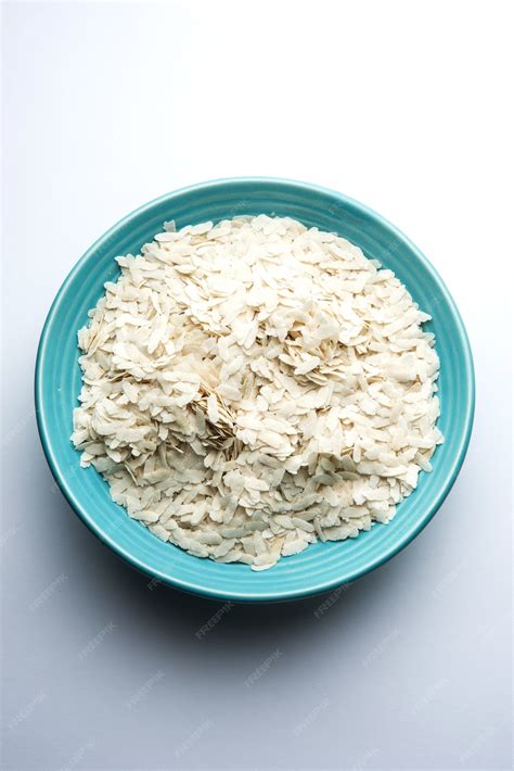 Premium Photo Raw Flattened Rice Or Thick Or Thin Rice Flakes For