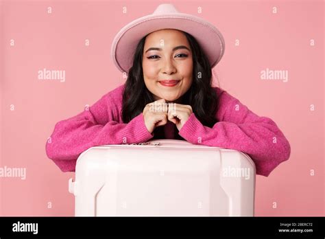 Image Of Lovely Beautiful Asian Girl Wearing Hat Smiling And Holding