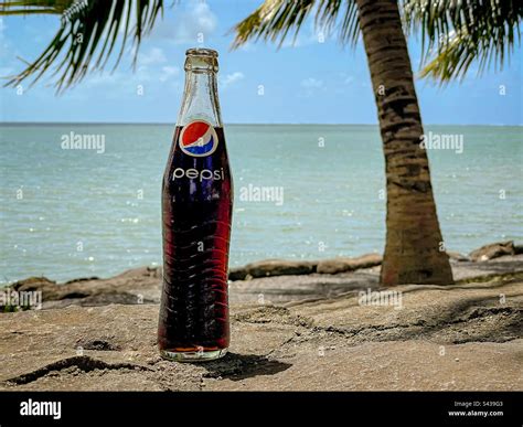 Pepsi Cola Glass Drink Bottle On Tropical Beach In Mauritius The Glass