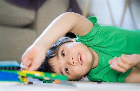 Premium Photo Portrait Of Girl Lying On Floor
