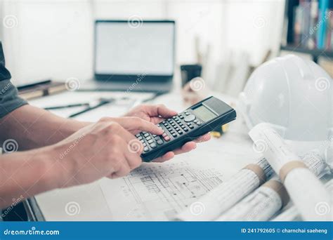 Architect Engineer Use Calculator For Calculate Drawing Design Working On Blueprint House
