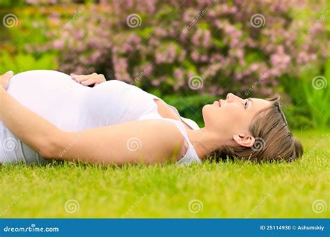Beautiful Pregnant Woman Lying On Sandy Beach With Palm Trees Royalty