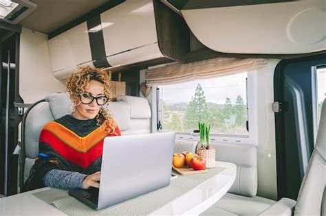 Premium Photo Independent Woman Sitting Inside A Camper Van In Smart