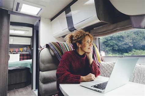 Premium Photo Adult Woman Use Laptop Computer Inside A Camper Van