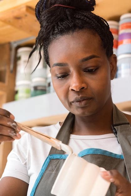 Premium Photo Female Ceramic Artist Glazing A Cup