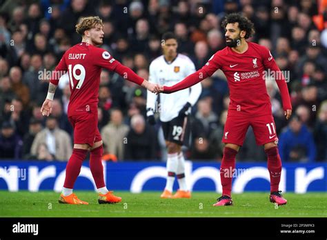 Liverpools Mohamed Salah Right And Liverpools Harvey Elliott Shake