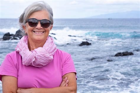 Premium Photo Portrait Of Smiling Woman On Beach