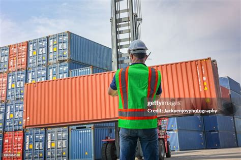 Worker Control Loading Containers Box From Cargo Freight Ship For