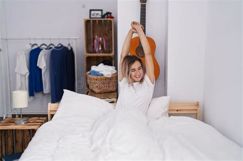 Young Woman Waking Up Stretching Arms At Bedroom Stock Image Image Of