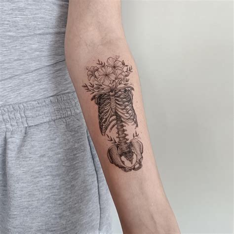 Rib Cage With Flowers Done By Irisnawerart At The Ink Collective