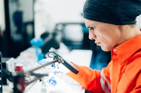 Premium Photo Professional Engineer Checking And Repairing Parts Of Machine