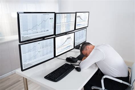 stock trader looking at multiple monitors stock image image of person
