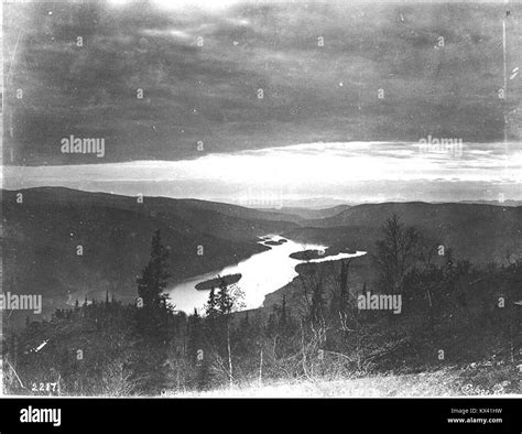 A Historical Photograph Showing Dawson City And The Yukon River At