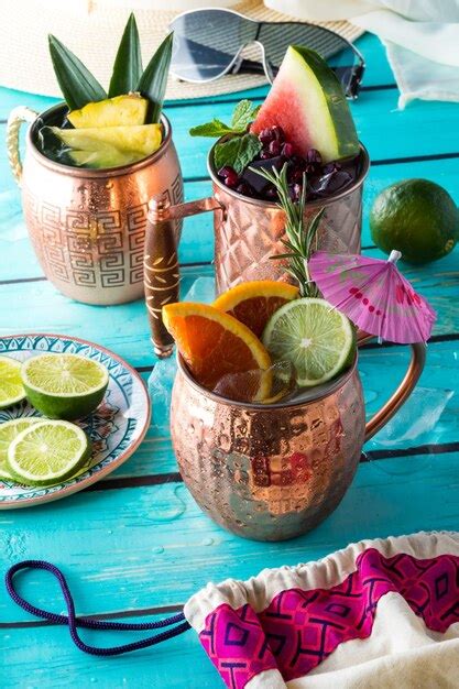 Premium Photo Vibrant Summer Cocktails With Fresh Fruit Garnishment