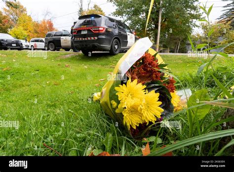 Flowers Left In Memory Of Two Fallen Police Officers Lie At The Scene