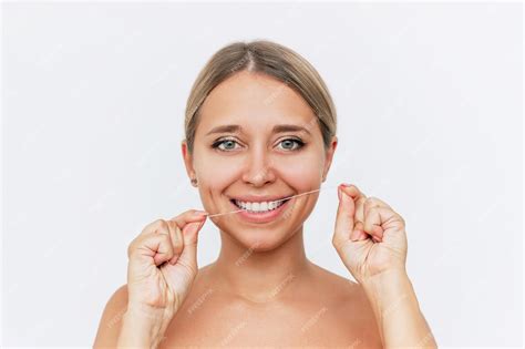 Premium Photo A Young Woman Smiles And Holds A String Between Her